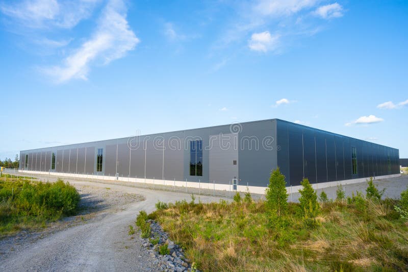 Exterior of a New and Large Grey Warehouse.. Stock Photo - Image of ...