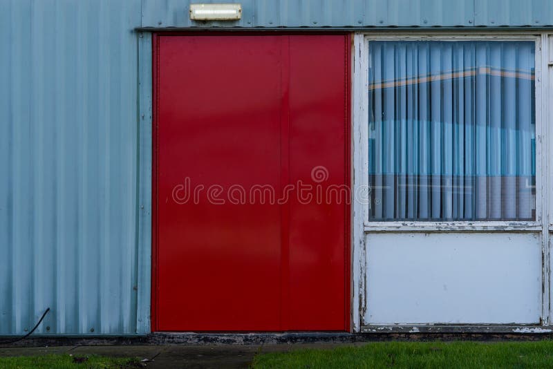Exterior of a Red Door in a Warehouse Building Stock Image - Image of ...