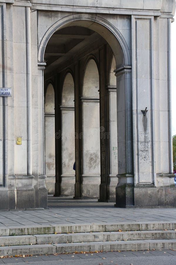 Exterior of a Stone Arch Building Gate with Poles, Vertical Shot Stock ...