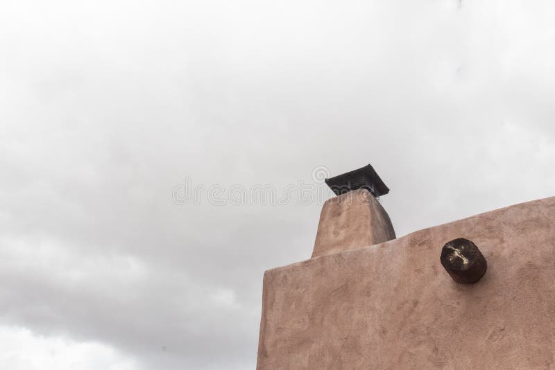 Exterior Red Adobe Building with Beams and Wood Sun Screen Slats, Blue ...