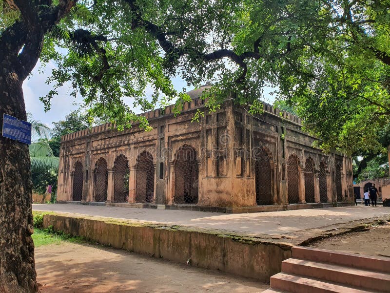 Historical Building with Arched Facade and Green Trees Stock Image ...