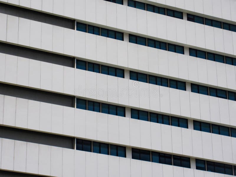 EXTERIOR of a WHITE WALLS MULTI-STORY BUILDING Stock Image - Image of ...