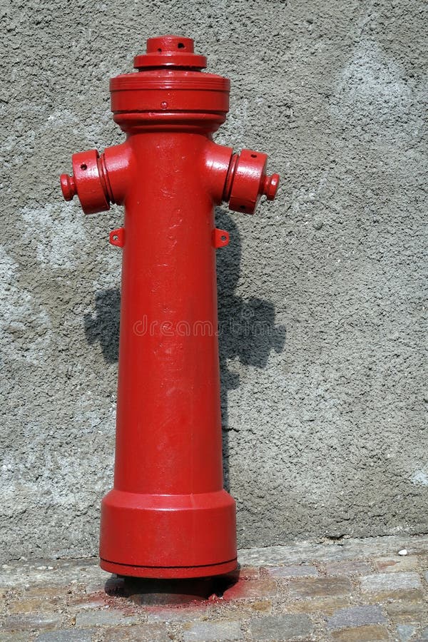 External Fire Hydrant Installed on a Paved Footway with a Gray Wall ...
