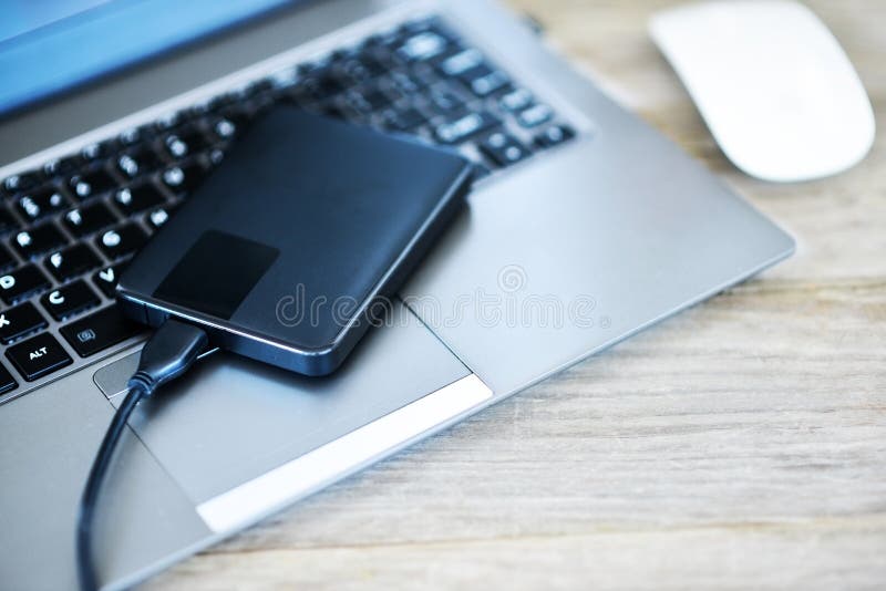External Hard Disc Drive Over Notebook Keyboard, Portable Memory Stock ...