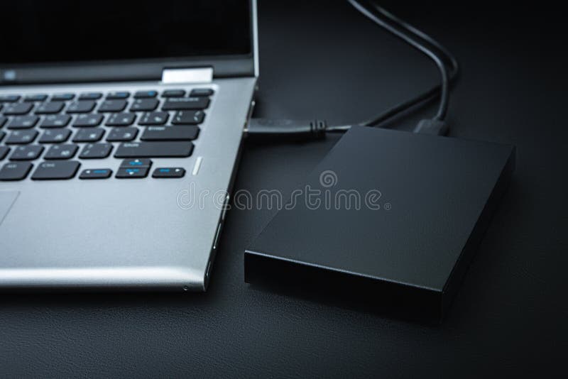 An External Hard Drive Connected To the Laptop with a Usb Cable Stock ...