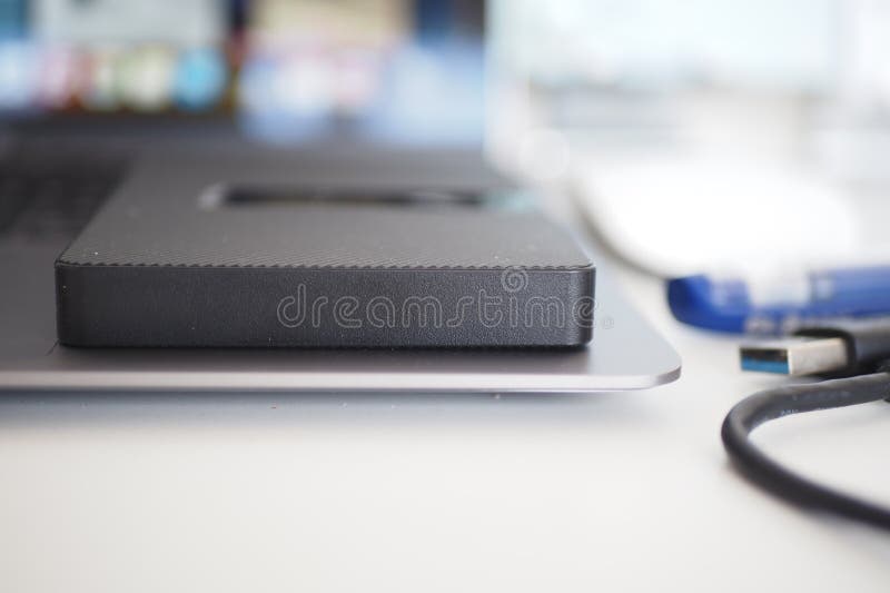 External Hard Drive on a Laptop Stock Image - Image of technological ...