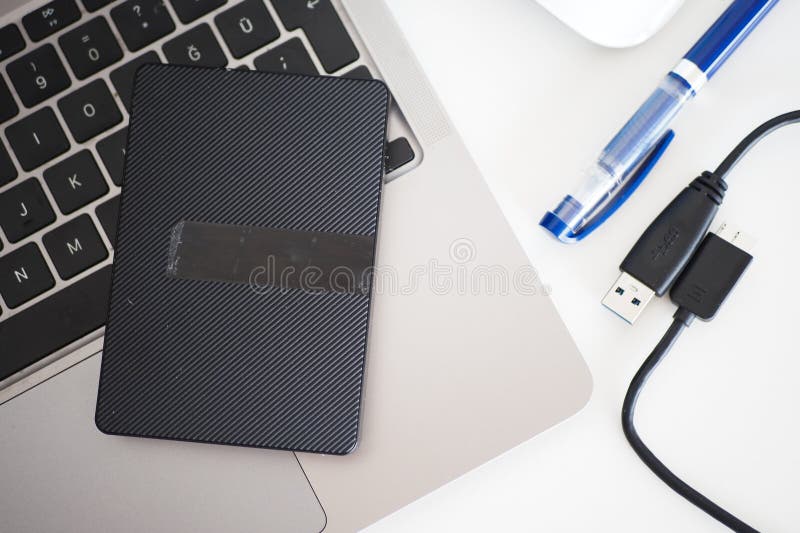 External Hard Drive on a Laptop Stock Photo - Image of technological ...