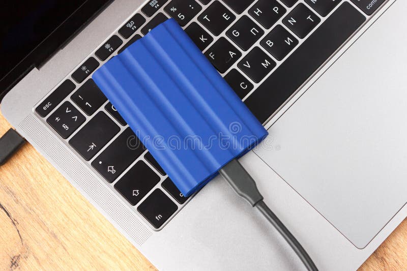 External Hard Drive on Laptop Keyboard, Office Desk Setup. Stock Photo ...
