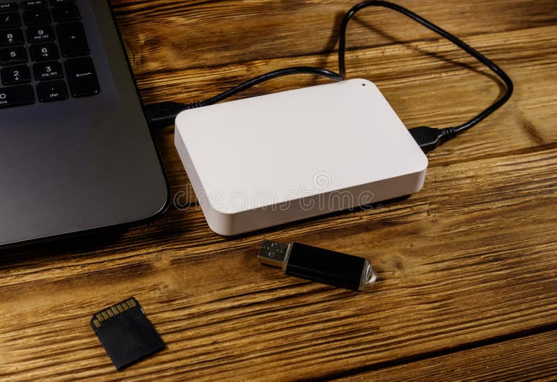 External HDD Connected To Laptop Computer, SD Memory Card and USB Flash ...