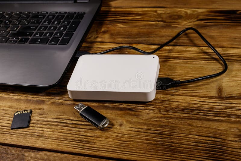External HDD Connected To Laptop Computer, SD Memory Card and USB Flash ...