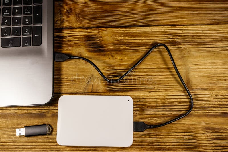 External HDD Connected To Laptop Computer and USB Flash Drive on a ...