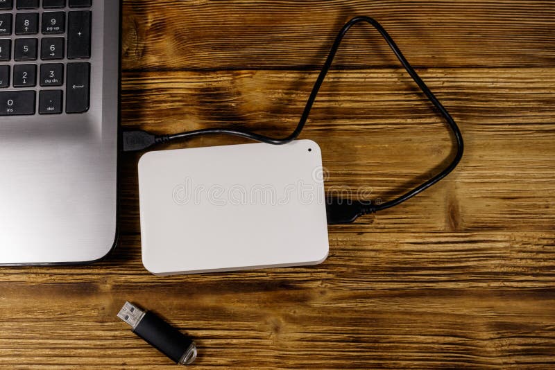 External HDD Connected To Laptop Computer and USB Flash Drive on a ...