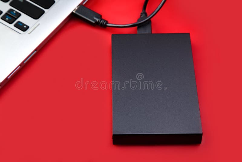 An External Hdd Connected To the Laptop with a Usb Cable Stock Photo ...