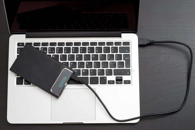 External HDD over laptop stock photo. Image of connected - 76158024