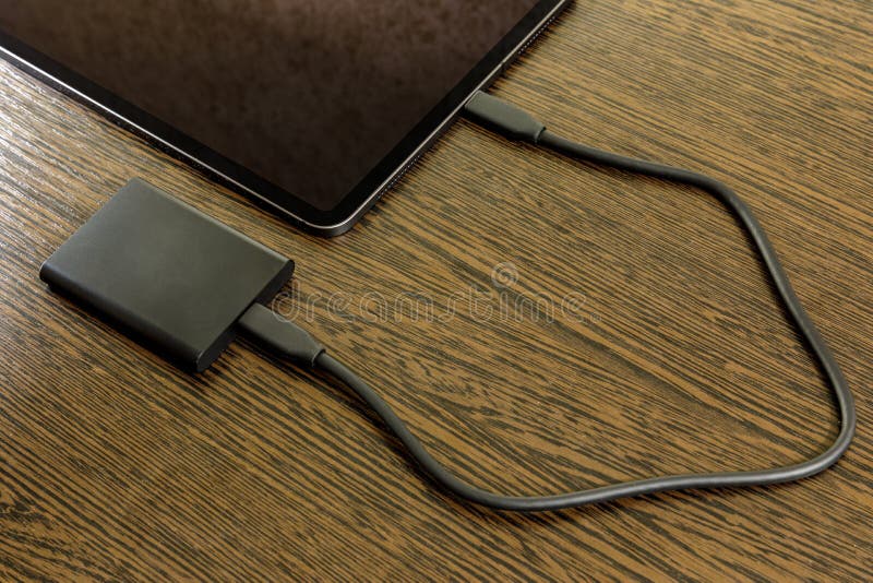 External Ssd Drive Connected To the Tablet. Stock Photo - Image of ...