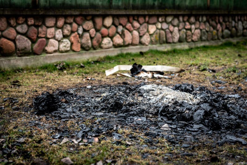 Extinct fire on the grass stock image. Image of wood - 198023783