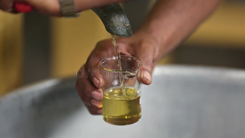 Extracted or Purified Liquid Soap Solution Being Taken for a Sample in ...