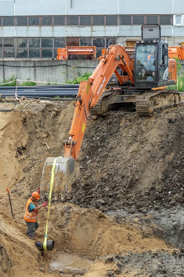 Extraction of a Pipe by Means of an Excavator Editorial Stock Image ...