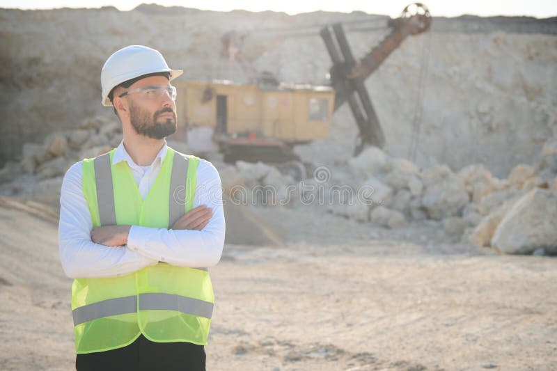 Extraction of Stone. Male Worker Next To Stone Quarry Stock Image ...