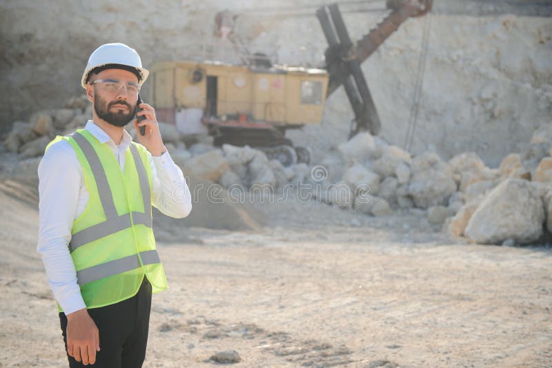 Extraction of Stone. Male Worker Next To Stone Quarry Stock Image ...