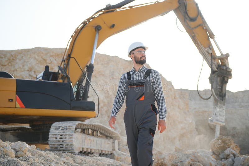 Extraction of Stone. Male Worker Next To Stone Quarry Stock Photo ...