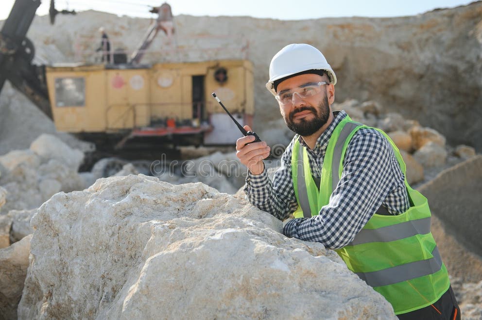 Extraction of Stone. Male Worker Next To Stone Quarry Stock Image ...
