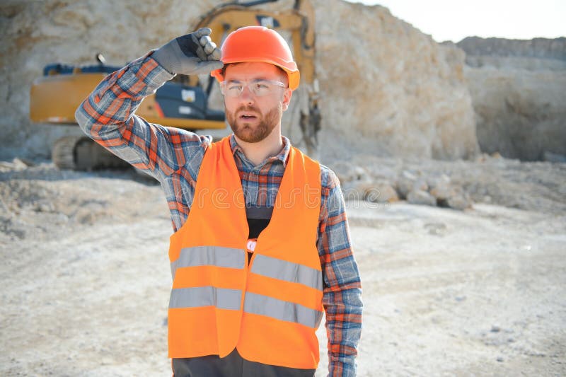Extraction of Stone. Male Worker Next To Stone Quarry Stock Image ...