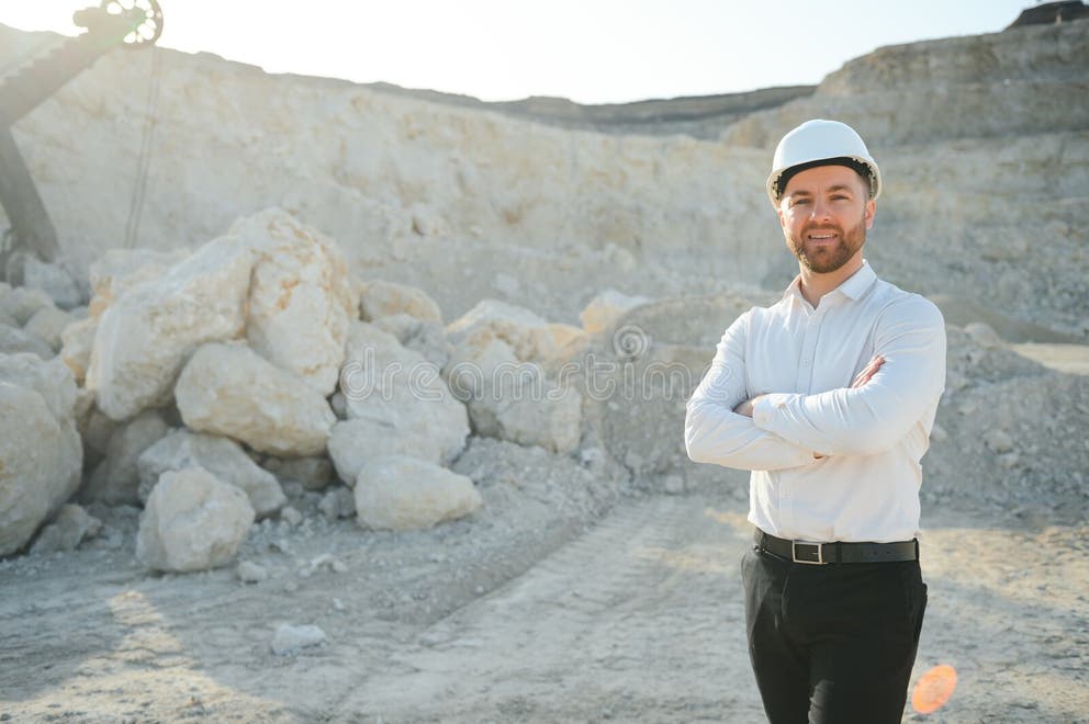 Extraction of Stone. Male Worker Next To Stone Quarry Stock Photo ...