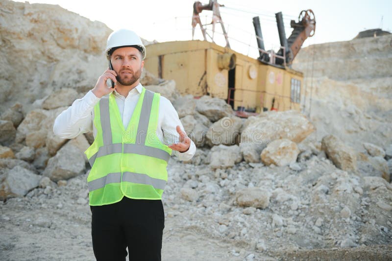 Extraction of Stone. Male Worker Next To Stone Quarry Stock Photo ...