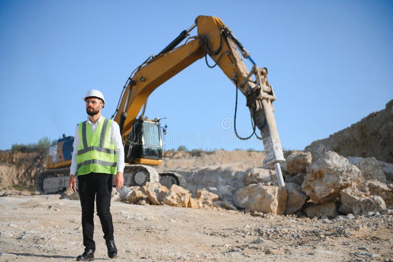 Extraction of Stone. Male Worker Next To Stone Quarry Stock Photo ...