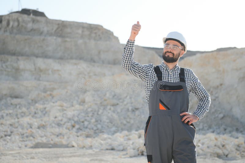 Extraction of Stone. Male Worker Next To Stone Quarry Stock Image ...