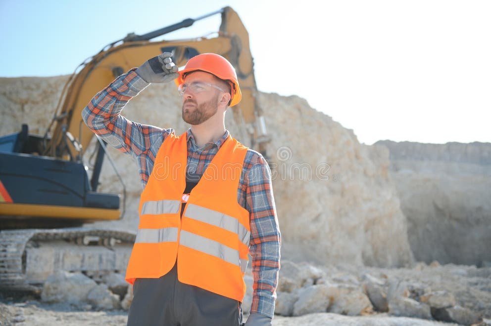 Extraction of Stone. Male Worker Next To Stone Quarry Stock Photo ...
