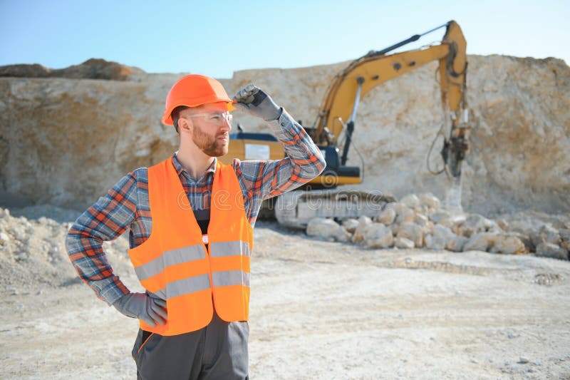 Extraction of Stone. Male Worker Next To Stone Quarry Stock Image ...