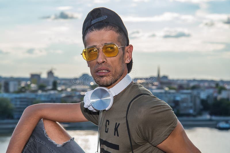 Extravagant Hipster Male Model is Singing on a Wooden Bench. Stock ...