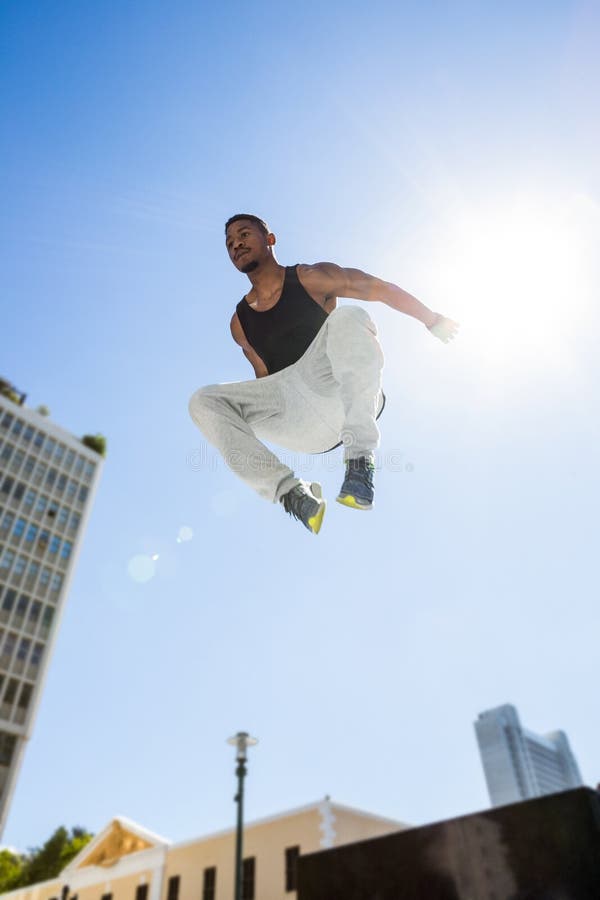 Extreme Athlete Jumping in Front of Building Stock Photo - Image of ...
