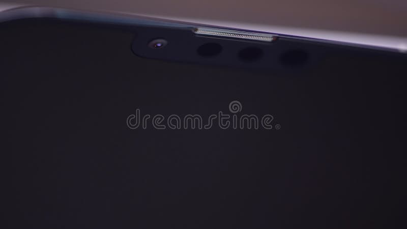 Extreme Close Up of a Smartphone Screen with Front Cameras. Action ...