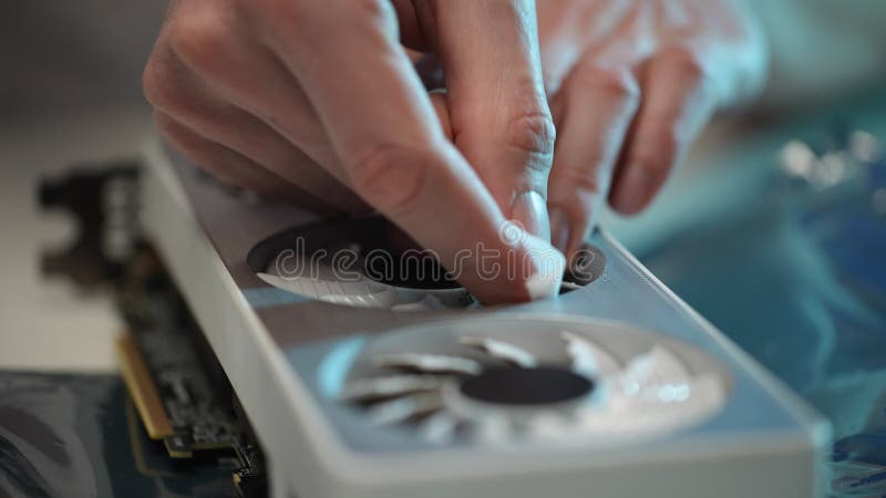 Extreme Close-up of Unrecognizable Computer Master Wiping Cooler Blades ...