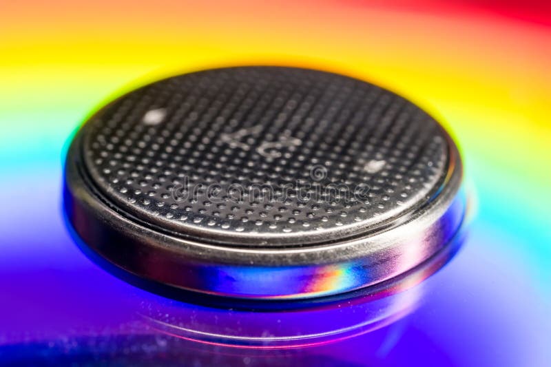 Extreme Close Up View of Button Battery on a Colorful Background Stock ...
