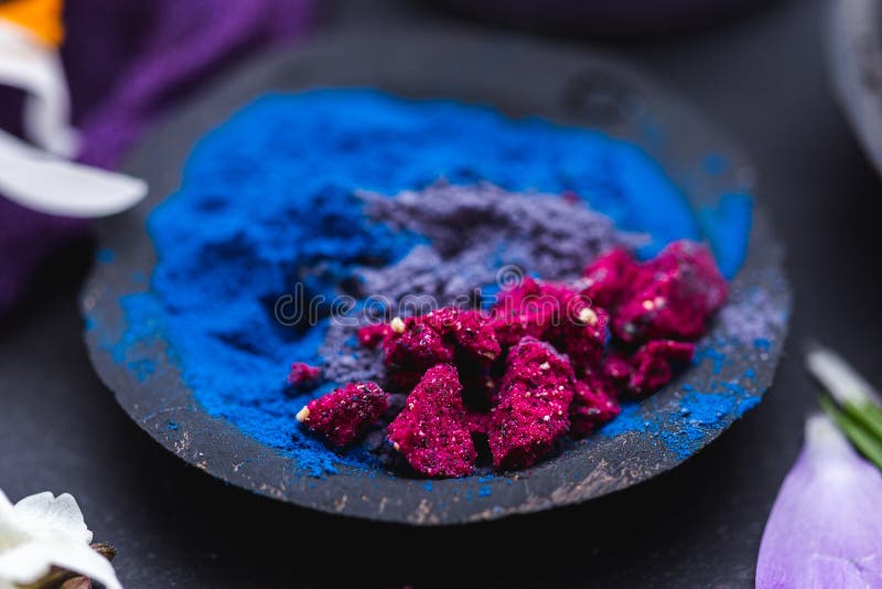 Extreme Closeup Shot of Purple and Blue Powder on a Coconut Shell Stock ...