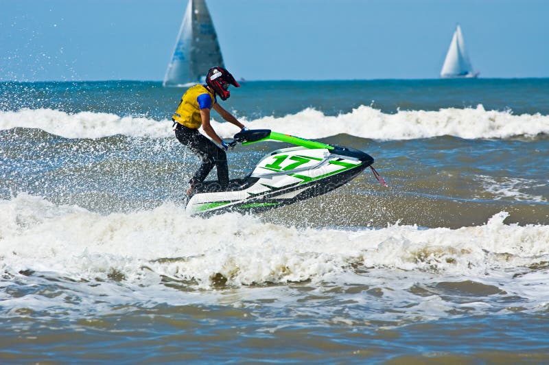 Jet ski in the waves editorial image. Image of power - 13592775