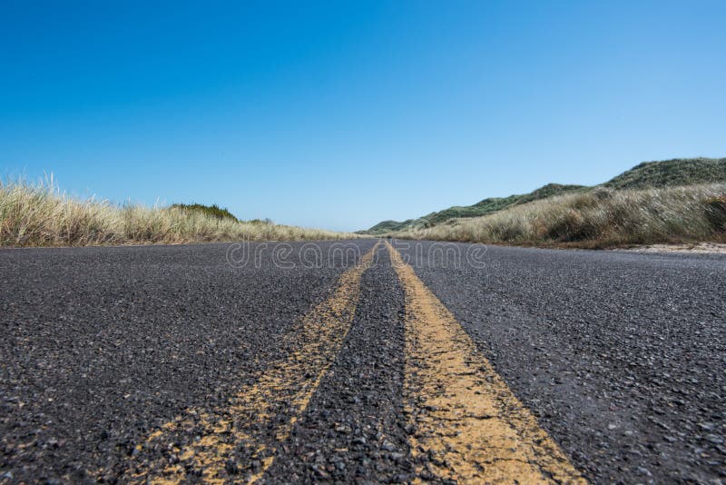 Extreme Low Angle of Road with Grasses Stock Image - Image of trip ...