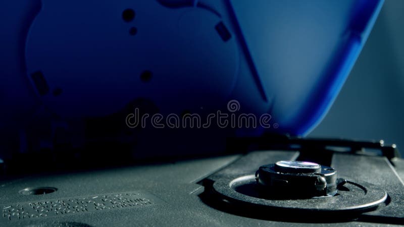 Extreme Macro of Compact CD Player. Man Hand Inserts Disc into Player ...