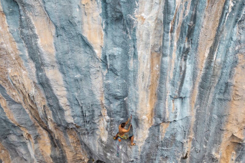 Extreme Sport, Strong Man, Rock Climber Climbs a Difficult Route Stock ...