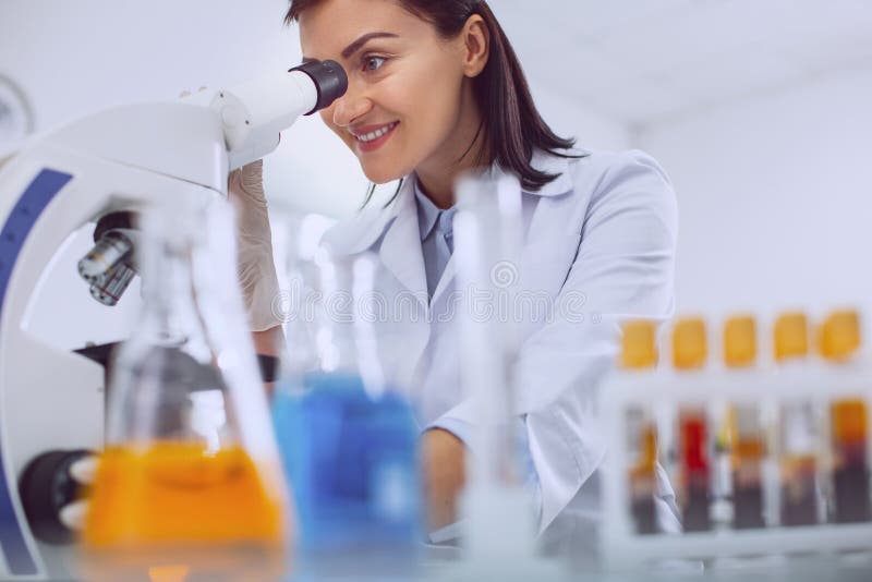 Exuberant Researcher Looking into the Microscope Stock Photo - Image of ...