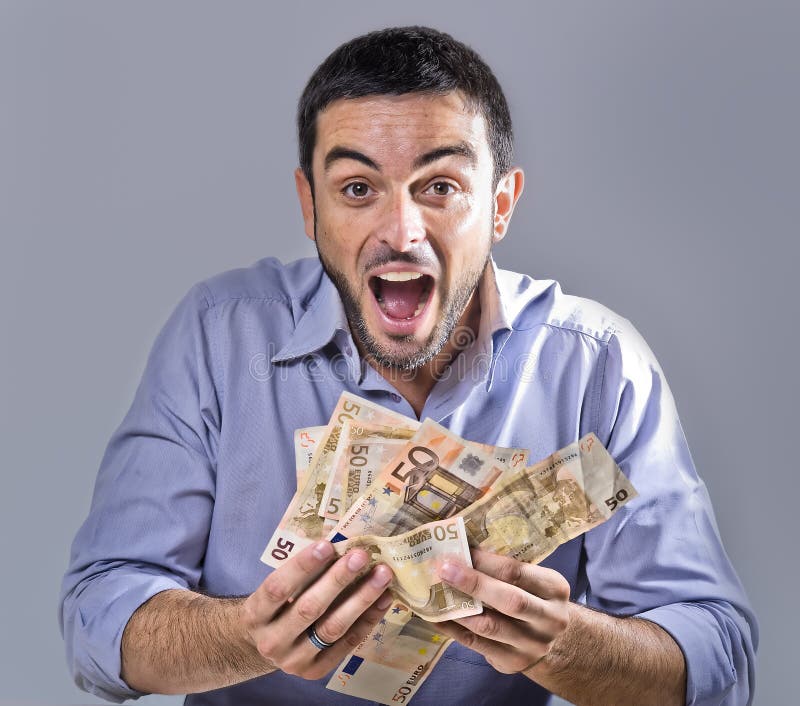 Exultant Young Man Holding Banknotes Stock Photo - Image of money ...