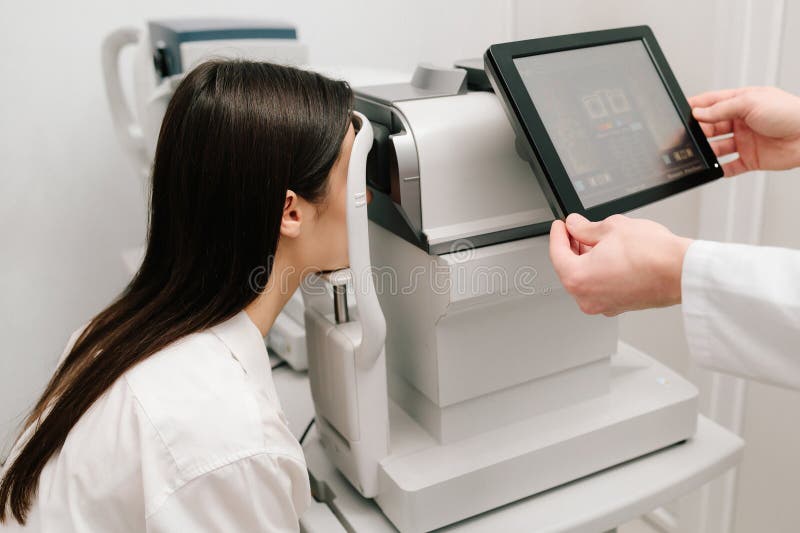 Eye Exam with Modern Autorefractor and OCT Machines. Autorefractor ...