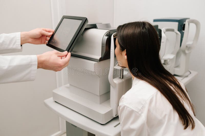 Eye Exam with Modern Autorefractor and OCT Machines. Autorefractor ...