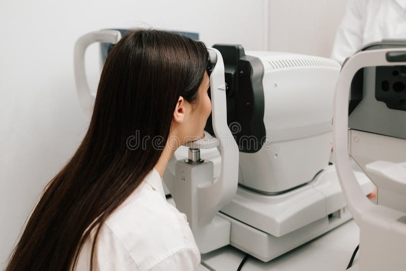 Eye Exam with Modern Autorefractor and OCT Machines. Autorefractor ...