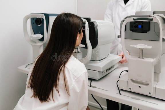 Eye Exam with Modern Autorefractor and OCT Machines. Autorefractor ...