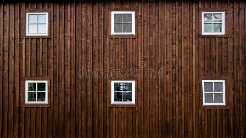 Eye-level Shot of the Facade of a Wooden Building with Windows Stock ...
